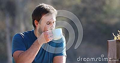 Man Contemplating and Drinking Coffee Outdoors Stock Footage - Video of ...