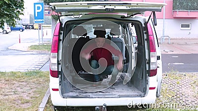 A Man Dancing in the Trunk Car. the Joy is the End of the Work Loader ...