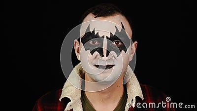 Man in Demon Makeup Looking and Camera and Smiling on Black Background ...