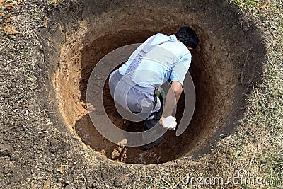 A Man Digging A New Well Editorial Photo | CartoonDealer.com #78870405