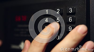 A Man Enters the Secret Code on a Safe Deposit Box Stock Footage ...