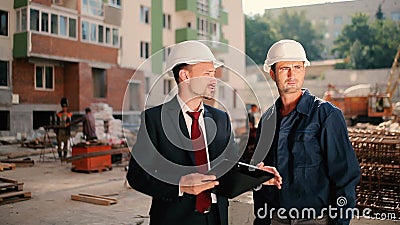 Man Explain the Worker How To Work at Construction Stock Video - Video ...