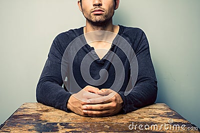 Man With Folded Hands Sitting At Desk Stock Photos - Image: 33046983