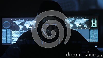 Man Geek Hacker in Hood with Glasses Working at Computer while Blue ...