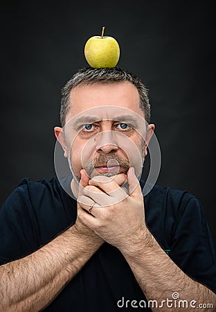 Man With A Green Apple On His Head Stock Image - Image: 31450941