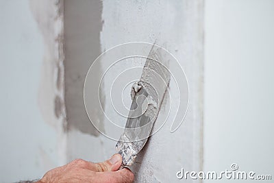 Man Hand With Trowel Plastering A Wall, Skim Coating Plaster Walls ...