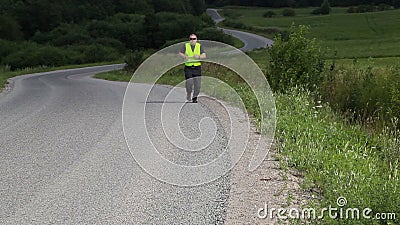 Man on highway slowly run stock footage. Video of exercises - 76130706