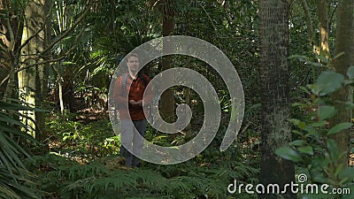 Man Hiking Exploring in Jungle Rainforst Using Compass Navigation ...