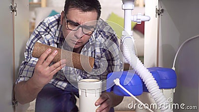 Man Inspects the Filter Element of a Home Water Filter Stock Footage ...