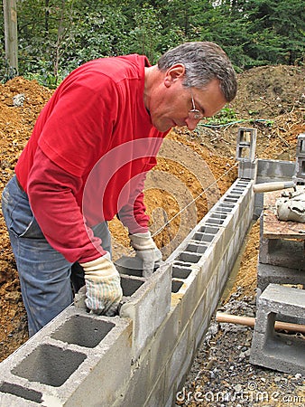 Man Laying Concrete Block Wall Royalty-Free Stock Image | CartoonDealer ...
