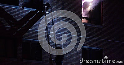 Man Make A Dramatic Escape From A Burning Building Stock Footage ...