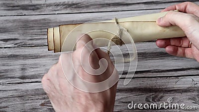 The Man Opens the Scroll. the Hand of Men Unfolds the Old Antique ...