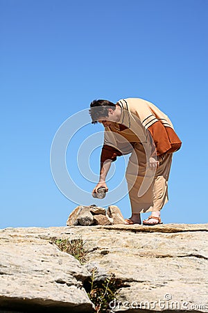 Man Picking Up Rock - Sin Royalty Free Stock Photo - Image: 4033265