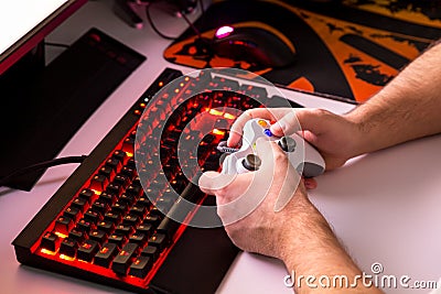 Man Playing Computer Game On Custom Made Desktop With Joypad, Keyboard ...