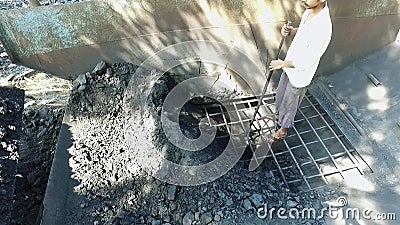 Man Pushing Coal and Steer Loader Dumping Coal at Conveyor Machine ...