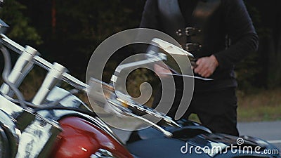 A Man Rides a Motorcycle Down a Road in Forest Stock Video - Video of ...