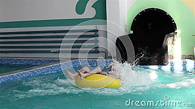 Man Rolled Down a Water Slide on Rubber Rings. Stock Video - Video of ...