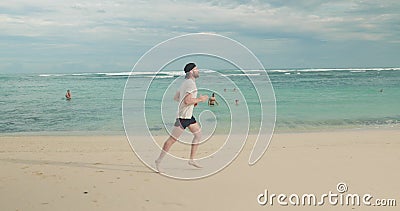 Man running on the beach stock footage. Video of outdoor - 183532988