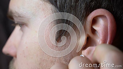 A Man Scratches His Ear and Thinks Stock Footage - Video of earlobe ...