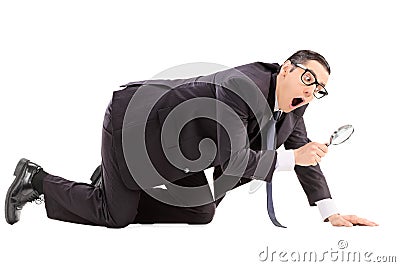 Man Searching For Something With A Magnifier Stock Photo - Image: 42057549