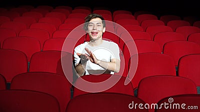 Man Sitting Alone and Clapping in Empty Cinema Hall or Theater Stock ...
