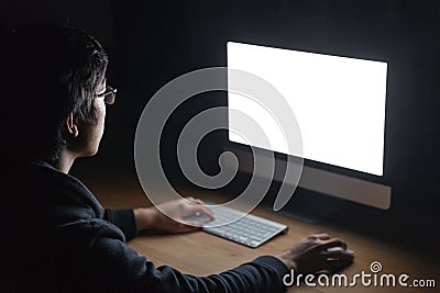 Man Sitting At Table And Using Computer In Dark Room Stock Photo ...