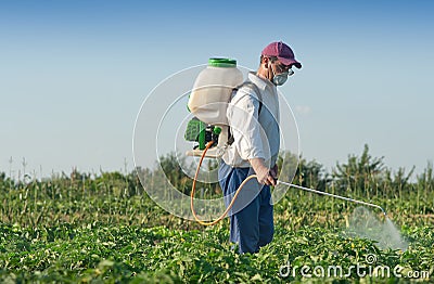 Man Spraying Vegetables Stock Photos - Image: 19296803