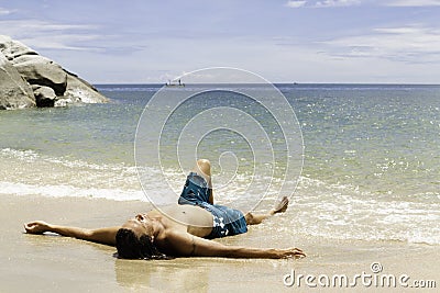 Man Sunbathing On The Beach Stock Photo - Image: 21132650