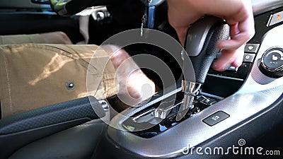 A Man Switches the Selector of the Automatic Transmission in Reverse ...