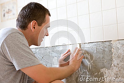 Man Tiling A Wall Stock Photo - Image: 5746870