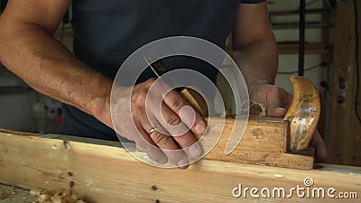 Man Using a Woodworking Tool - Soviet Wooden Planer on a Table with His ...