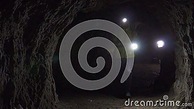 Man Volunteer with a Flashlight in His Hand and on His Forehead Looking ...