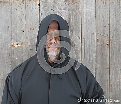 Man Wearing A Black Hooded Cape Stock Photo - Image: 57846883