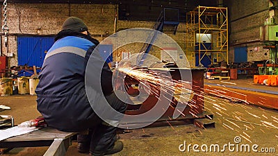 A Man Working With A Grinding Machine. Fire Sparkles Stock Image ...