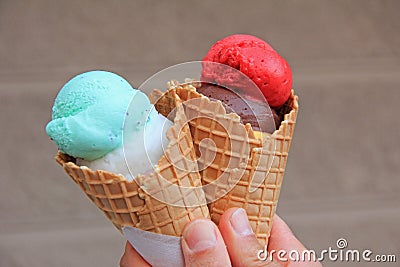 Mans Hand Holding Two Ice Cream Wafers With Various Scoops Stock ...