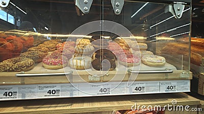 Many Donuts on Shelves in a Supermarket or Bakery. Stock Footage ...