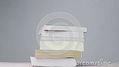 Many Old Books Falling on the Table and Spread Dust Throughout the Room ...