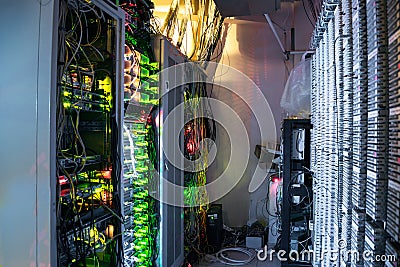 Many Wires And Computer Equipment Work In A Dark Server Room. The ...