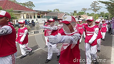 Marching Parade of Elementary School Students in Red and White Uniforms ...