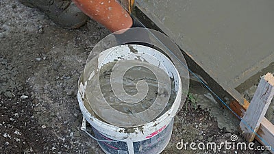 Master picking up concrete stock video. Video of beige - 228367965