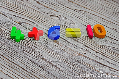 Math Example With Color Numbers On A Wood Background Royalty-Free Stock ...