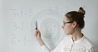 Math Teacher Explaining Primary School Basic Mathematics On Whiteboard ...