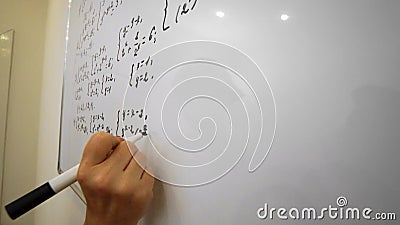 Elderly Teacher is Writing Equation on the Whiteboard. Stock Video ...