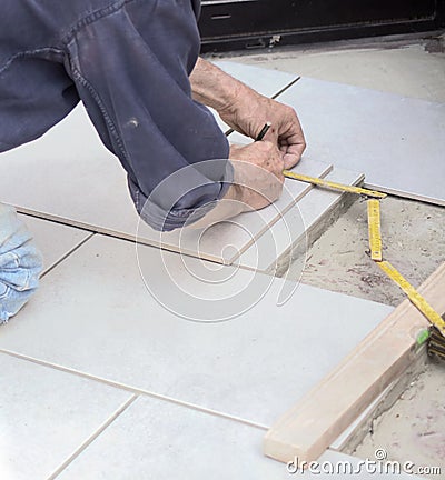 Measuring A Floor Tile 2 Royalty-Free Stock Photography | CartoonDealer ...
