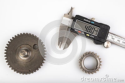 Measuring The Gears With A Caliper. Engineering Work In The Laboratory ...