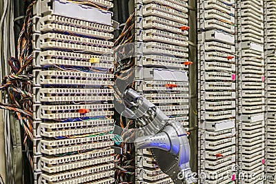 A Mechanical Hand Is Next To The Ip Telephony Patch Panel. The Robot ...