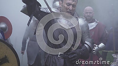 Medieval Battlefield, General is Pulling Out His Sword in the Smoke ...
