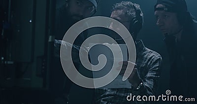 Director Holding the Script and Discussing with Technicians Stock ...