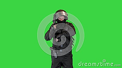 Counter Terrorist Soldier in Armor Standing and Reloading Machine Gun ...