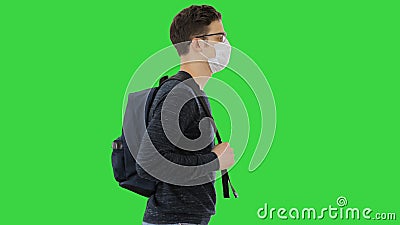 Student in Protective Masks Walking with Backpack on a Green Screen ...